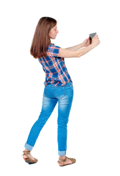 Back view of standing young beautiful woman using a mobile pho Stock ...