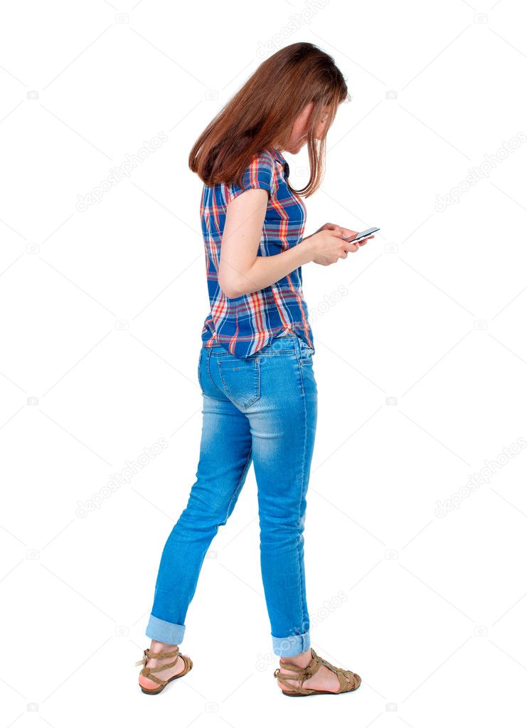 Back view of standing young beautiful woman using a mobile phon Stock ...