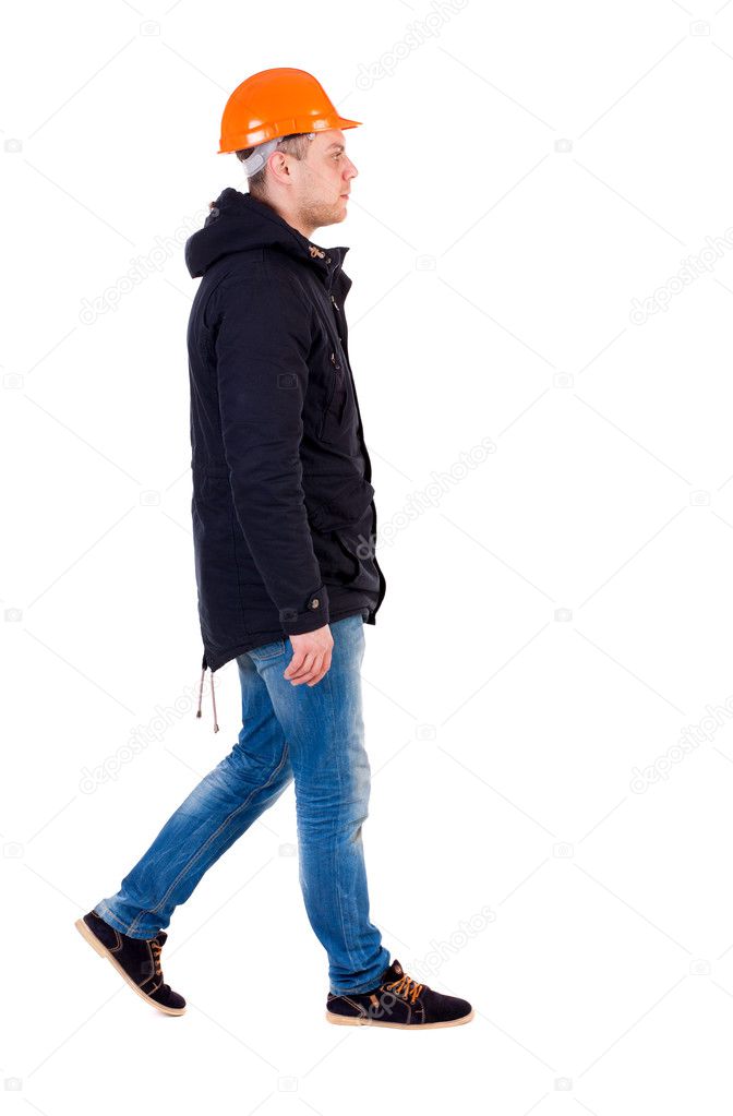 Back view of walking engineer in helmet. Stock Photo by ©ghoststone ...