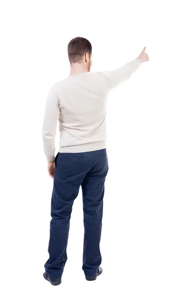 Back view of pointing young men in shirt and jeans. — Stock Photo ...