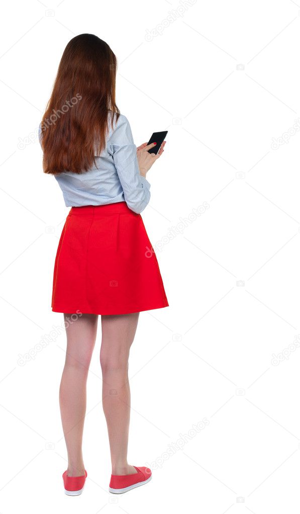 Back view of standing young beautiful woman using a mobile phon Stock ...