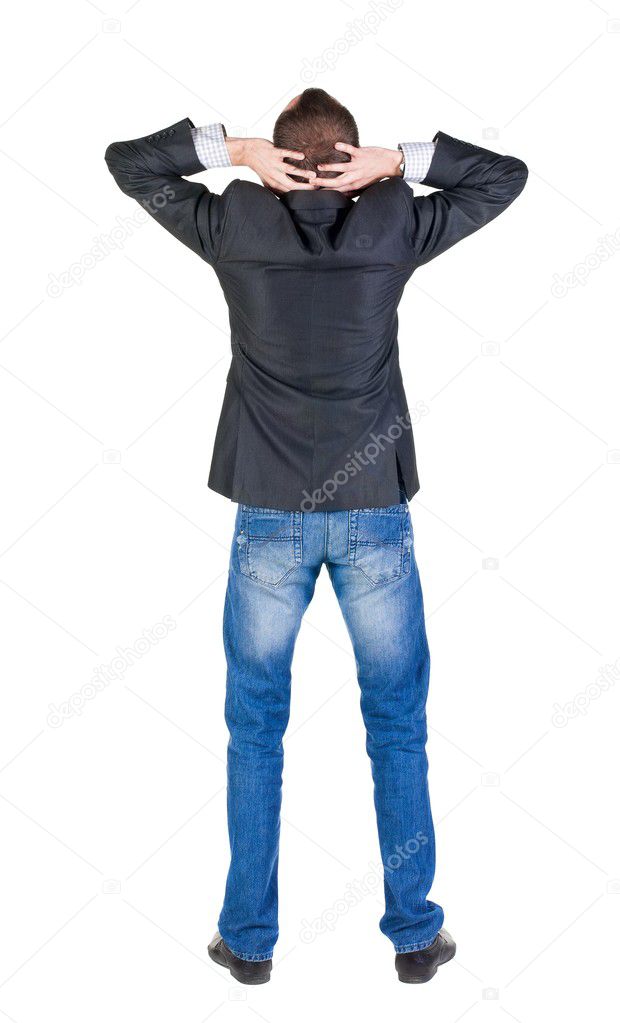 Back view of shocked and scared young business man. Holds hands Stock ...