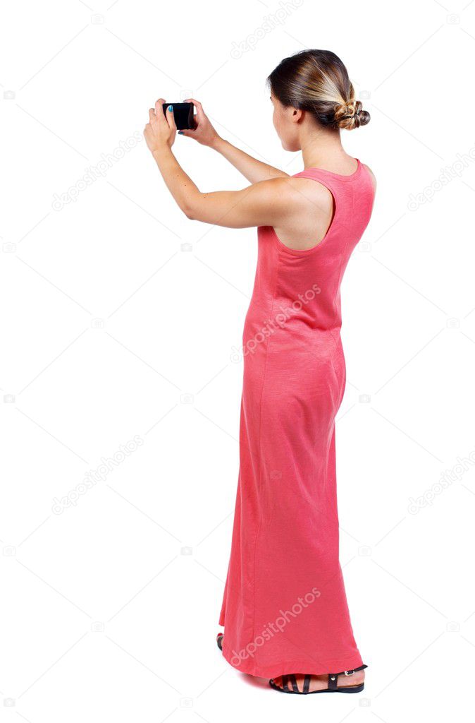 Back view of standing young beautiful woman using a mobile phon Stock ...