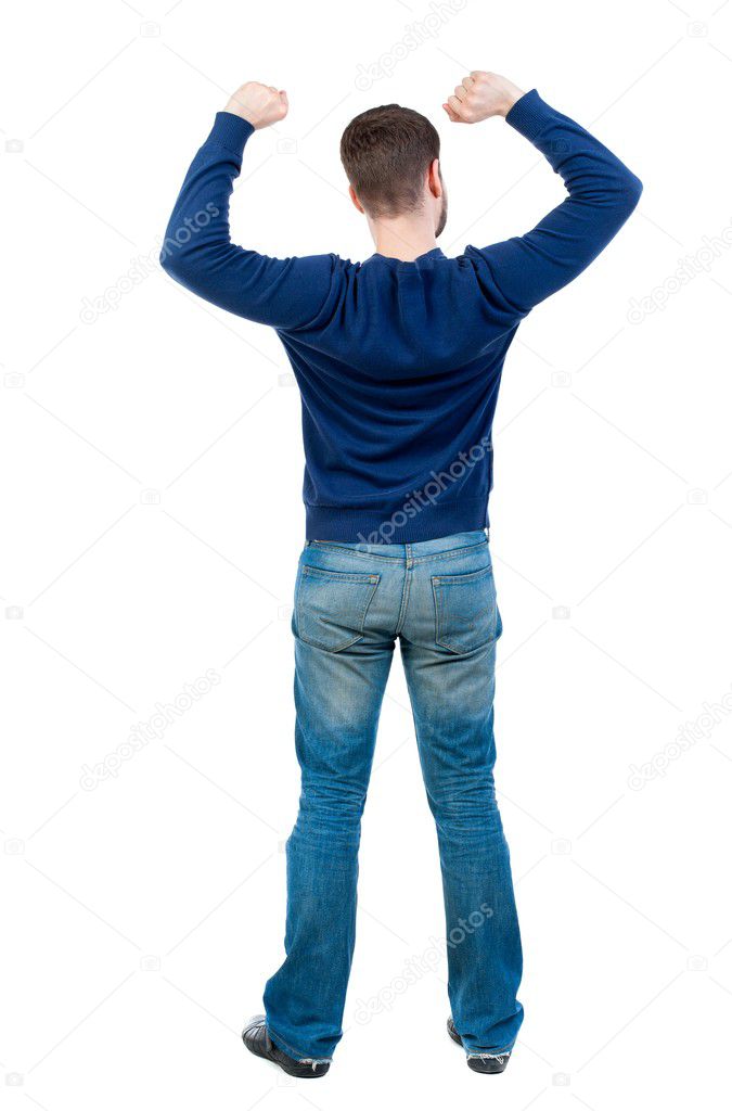 Back view of man. Raised his fist up in victory sign. Stock Photo by ...