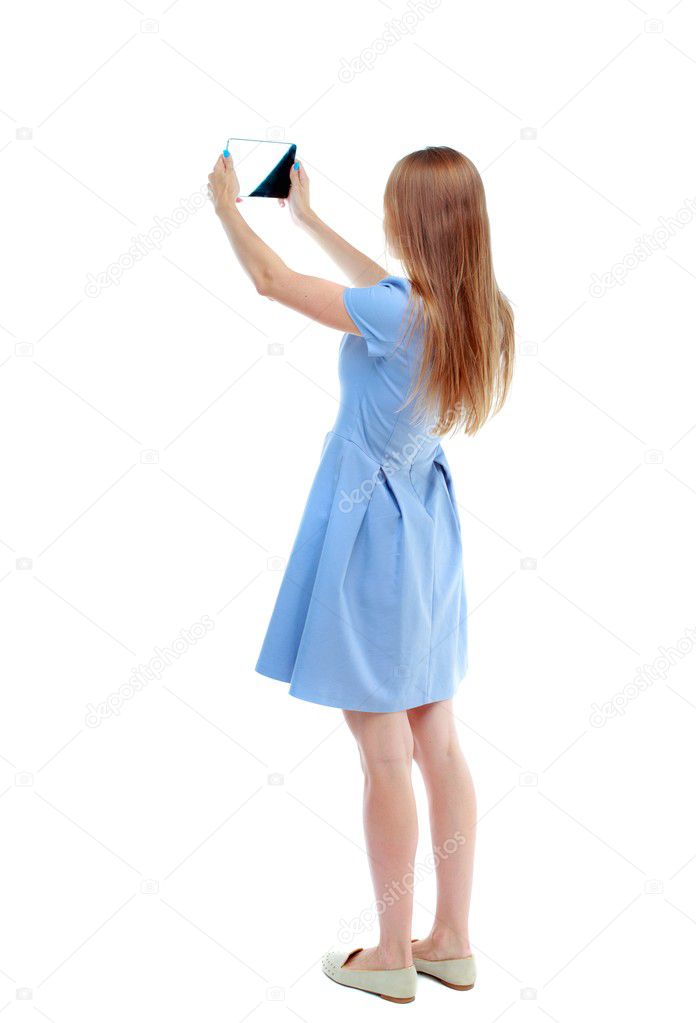 Back view of standing young beautiful woman using a mobile pho Stock ...