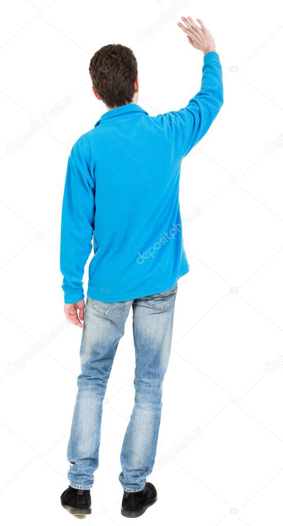 Back view of handsome man greeting waving from his hands Stock Photo by ...