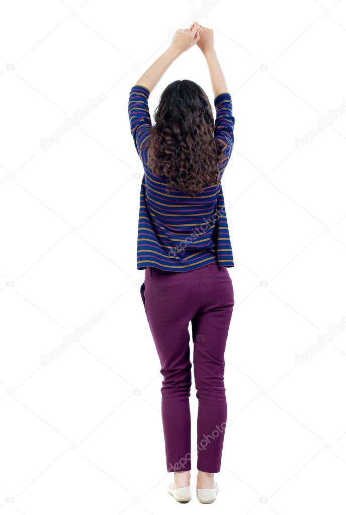 Back view of dancing young beautiful woman. girl watching. Stock Photo ...