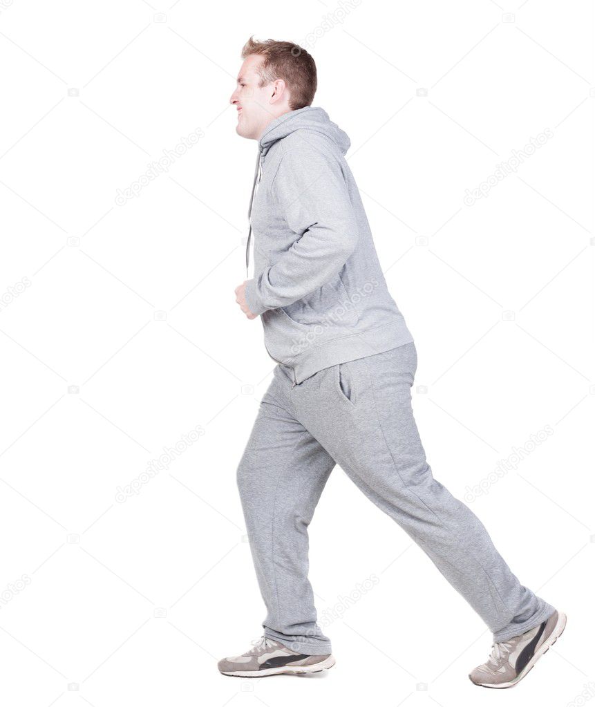 Back view of running athlete man in tracksiut . Stock Photo by ...