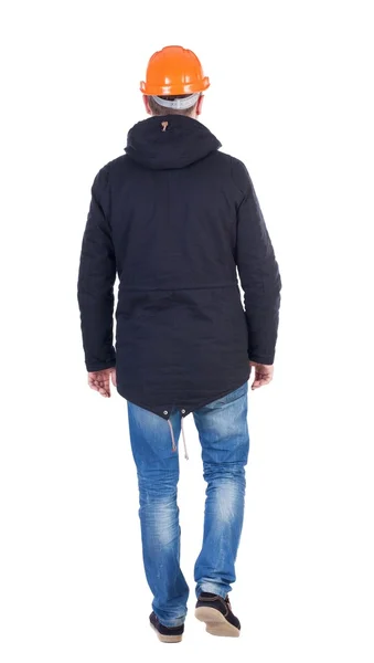 Back view of walking engineer in helmet. Stock Photo by ©ghoststone ...