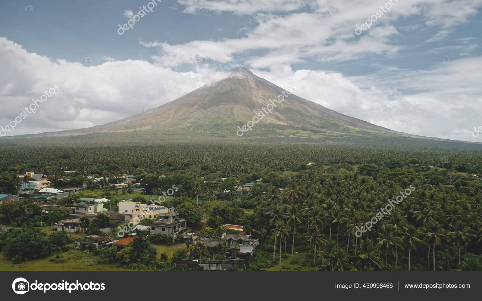 Tropic countryside with palm trees aerial. Mayon volcano hillside ...