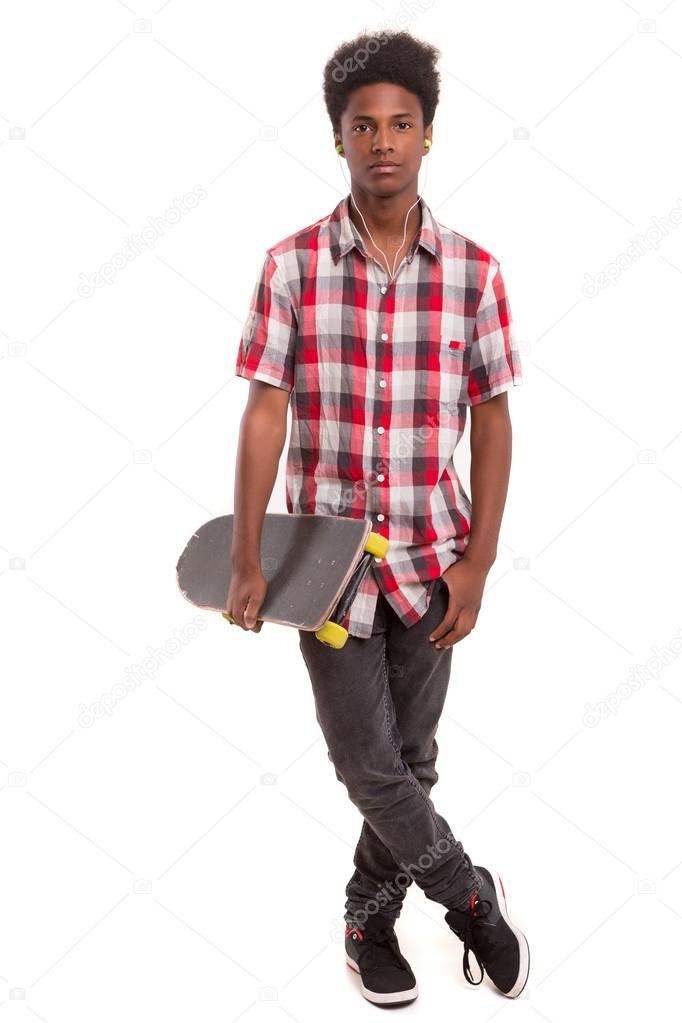 Skater boy posing with skateboard Stock Photo by ©hsfelix 80261284