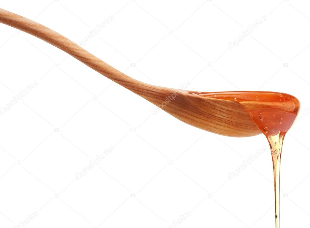 Spoon with pouring honey Stock Photo by ©natika 78983238