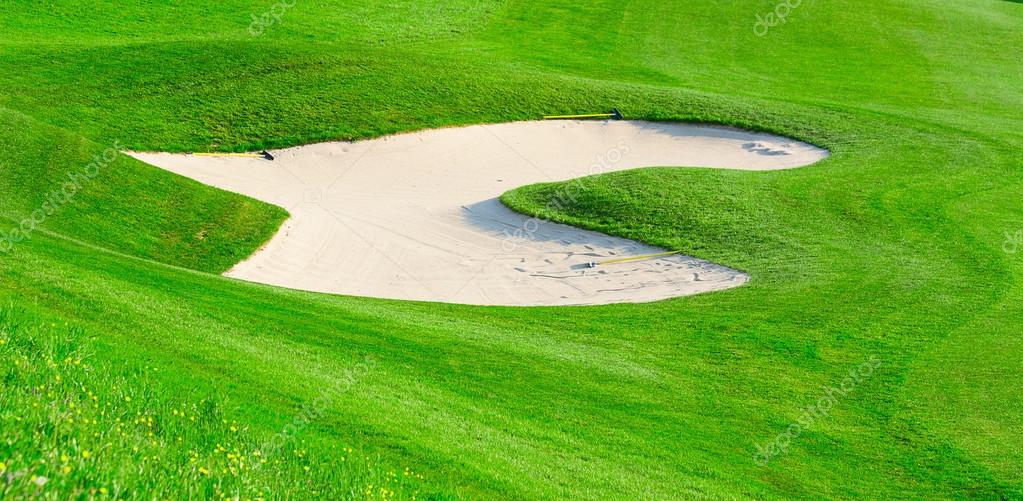 Sand bunker on the golf field Stock Photo by ©swisshippo 117003700