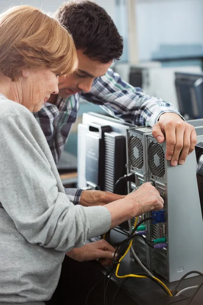 Tutor And Senior Student Setting Up Computer Stock Photo by ©SimpleFoto ...