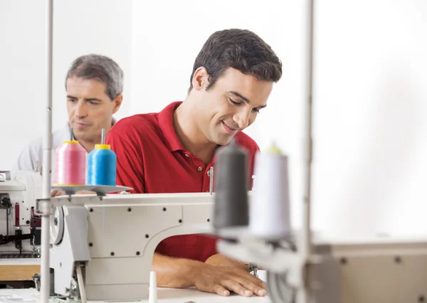 Tailor Using Sewing Machine In Factory Stock Photo by ©SimpleFoto 122473112