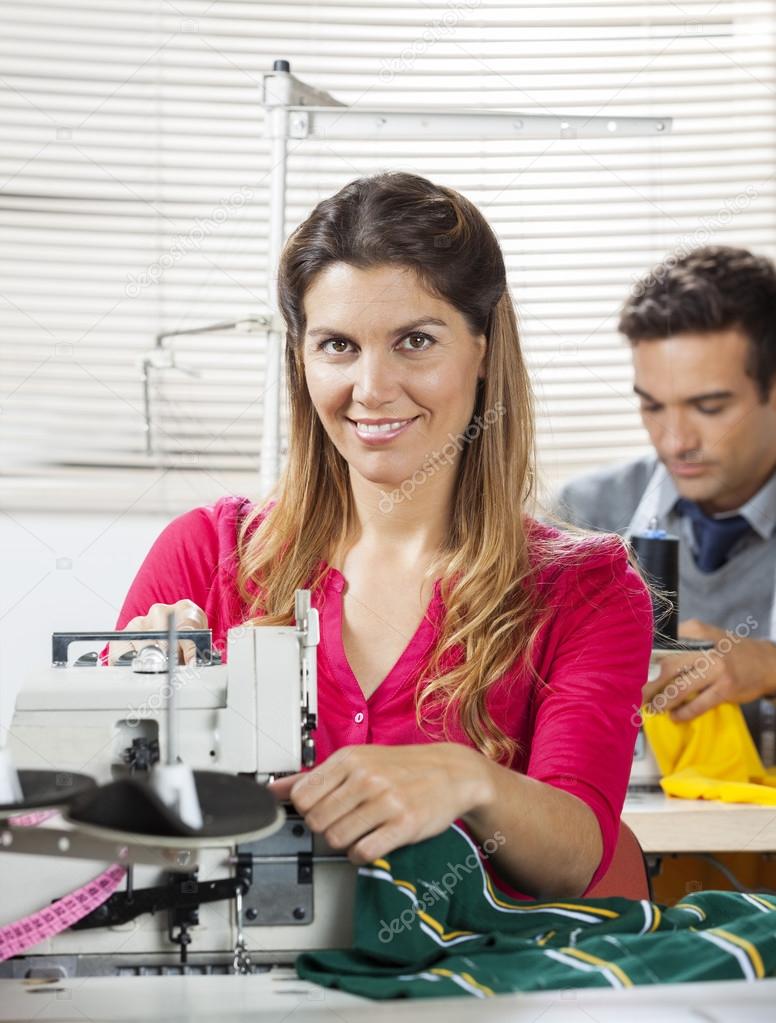 Happy Tailor Working At Workbench In Factory Stock Photo by ©SimpleFoto ...