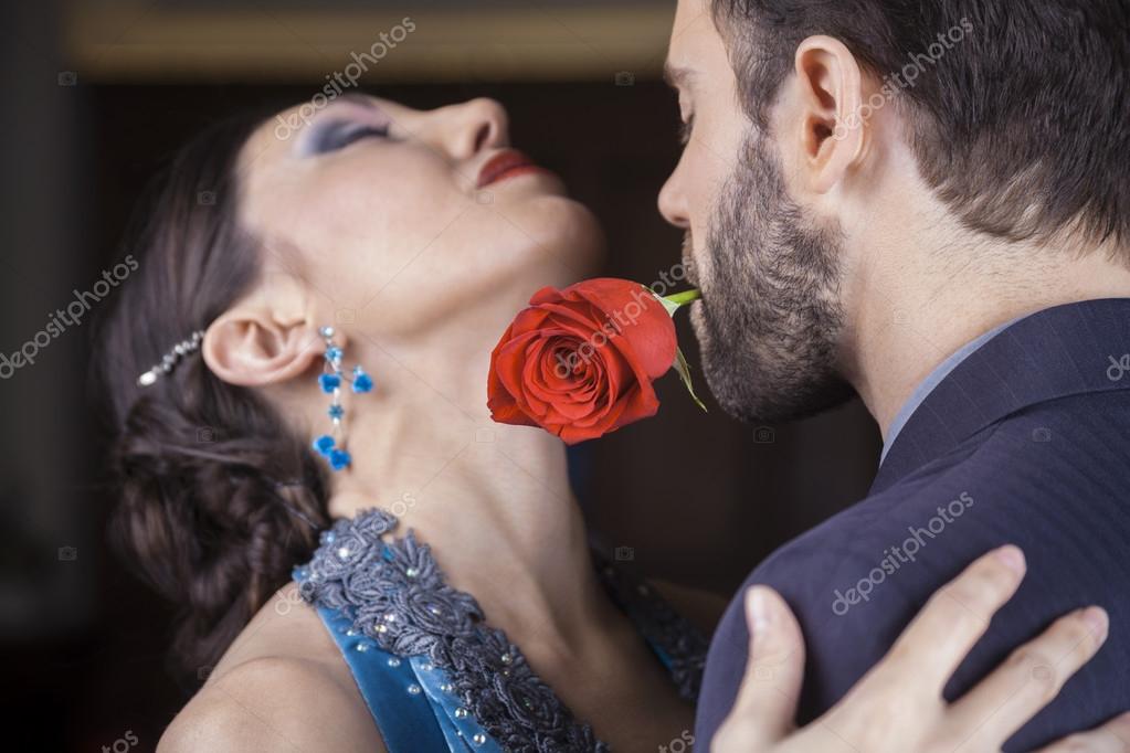 Tango performer holding rose in mouth Stock Photo by ©SimpleFoto 122521304