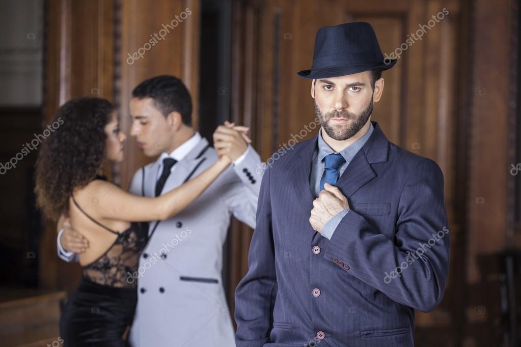 Confident Male Tango Dancer With Partners Performing In Backgrou ...
