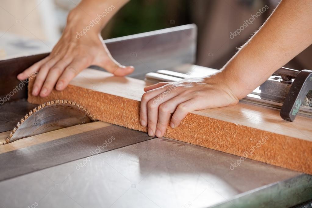 Carpenters Hands Cutting Wood With Tablesaw — Stock Photo © SimpleFoto ...