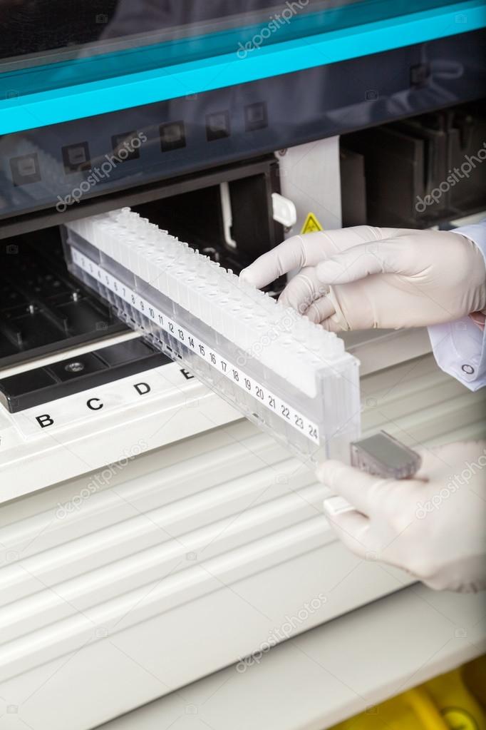 Researcher Loading Samples In Analyzer Stock Photo by ©SimpleFoto 54504231