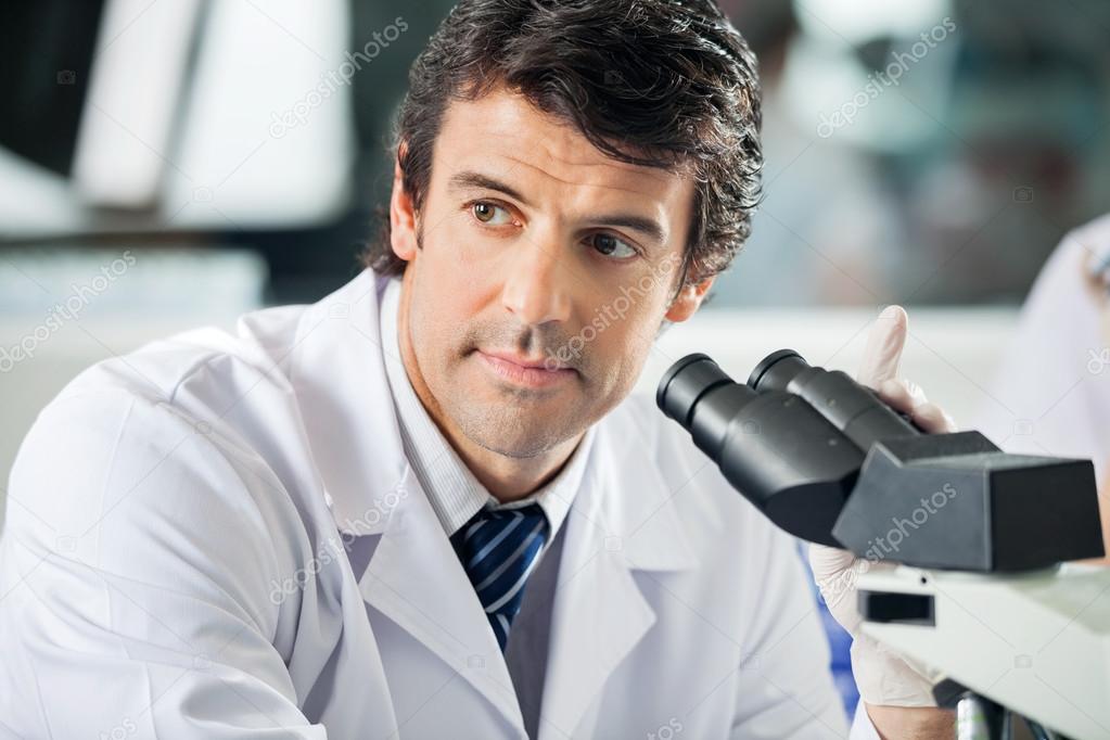 Scientist Using Microscope In Laboratory Stock Photo by ©SimpleFoto ...