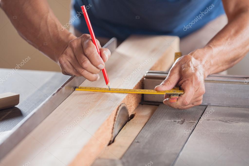 Cropped Image Of Carpenter Measuring Wood At Tablesaw — Stock Photo ...