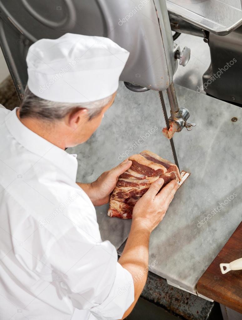 Butcher Cutting Fresh Meat With Bandsaw — Stock Photo © SimpleFoto ...