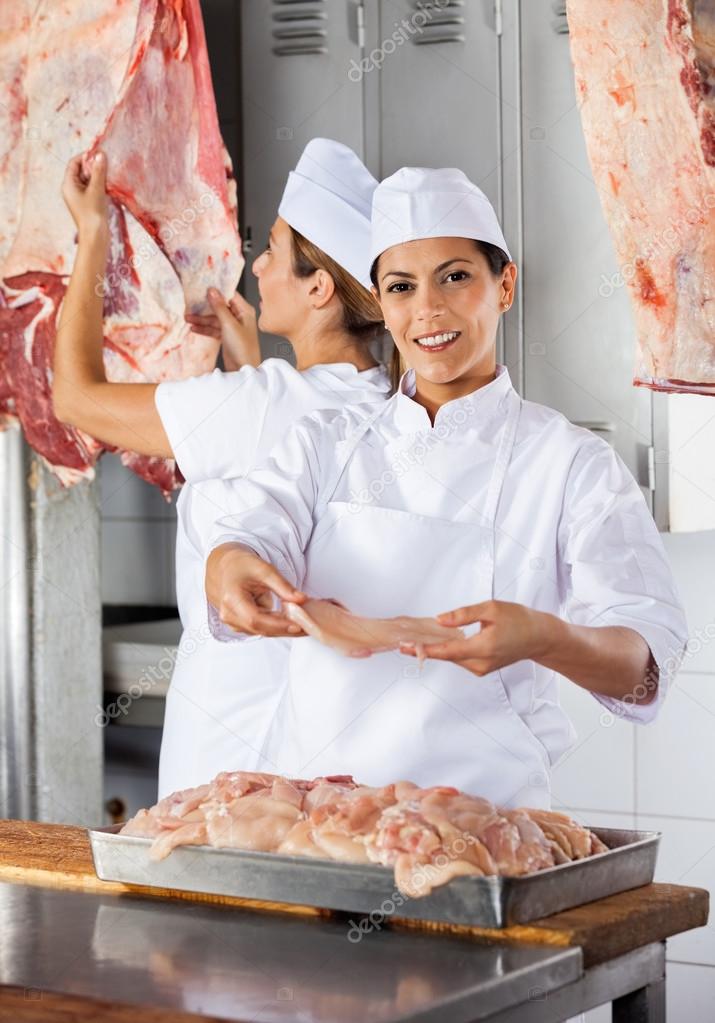 Female Butcher Offering Raw Meat At Shop Stock Photo by ©SimpleFoto ...