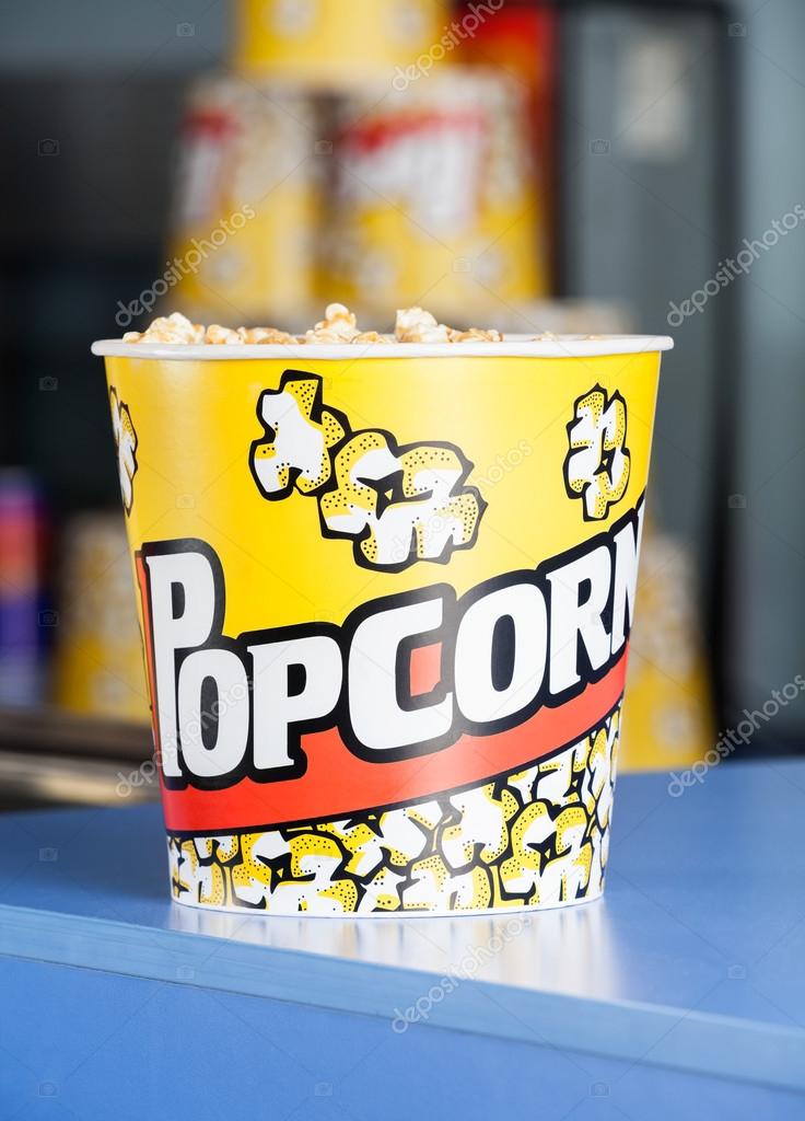 Popcorn On Cinema Concession Counter — Stock Photo © SimpleFoto #71729431