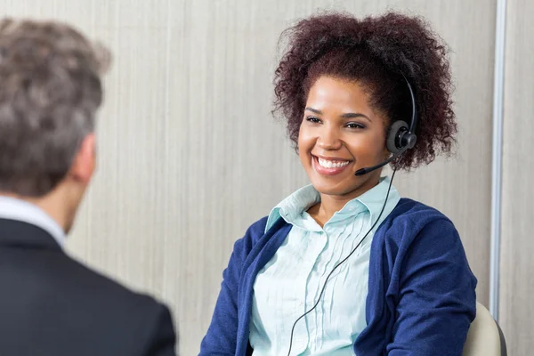 Happy Female Customer Service Agent Looking At Manager - Stock Image ...