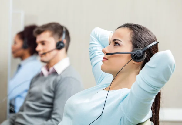 Tired Female Customer Service Representative In Call Center Stock Photo ...