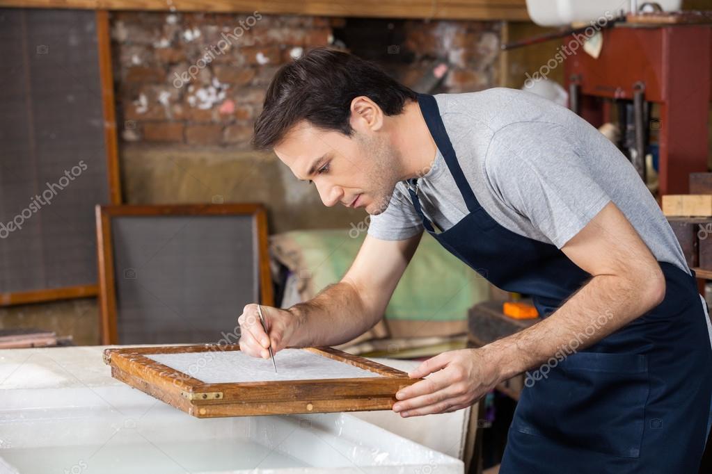 Worker Using Tweezers To Clean Paper In Factory — Stock Photo ...