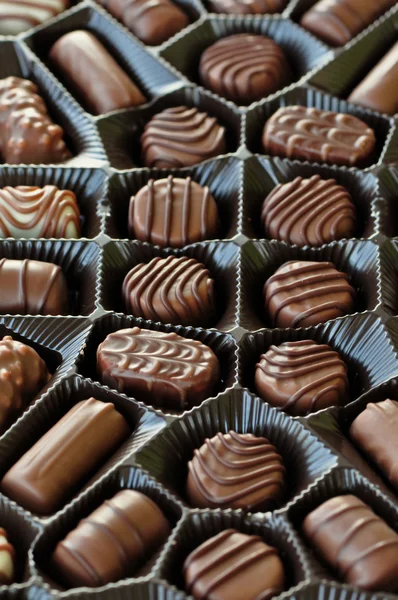 Pictures: box of chocolate | Box of chocolates background — Stock Photo ...