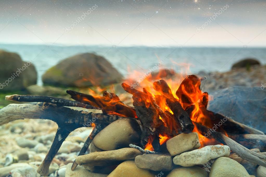 Fire at sea — Stock Photo © Lindrik #64404099
