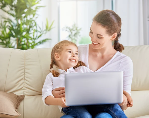 Family with computer — Stock Photo © pressmaster #11662219
