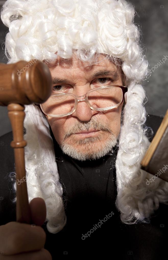 Old male judge in a courtroom striking the gavel Stock Photo by ...