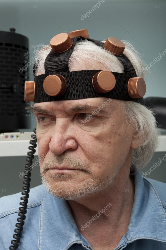Man crazy inventor wearing a helmet brain research Stock Photo by ...