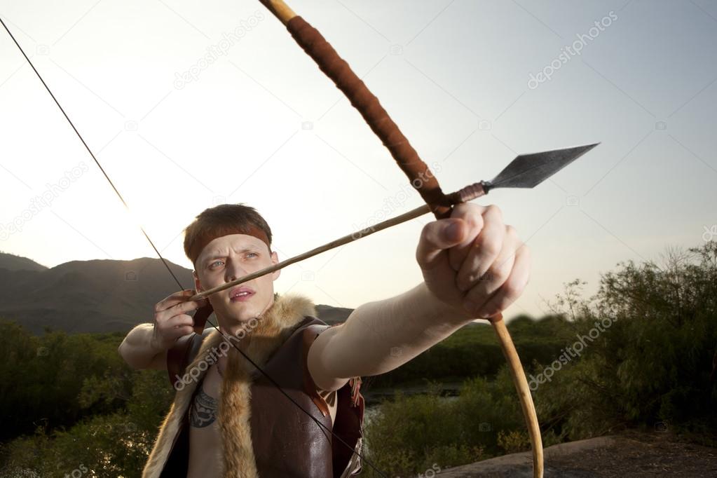 Robin Hood. Archer with arrow and long bow Stock Photo by ©andreyuu ...
