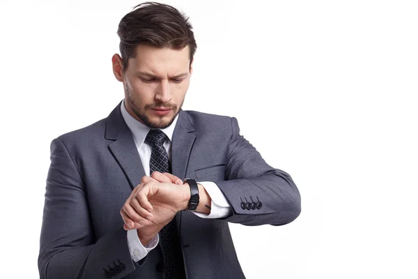 Young business man looking at watch Stock Photo by ©zoomteam 71410841