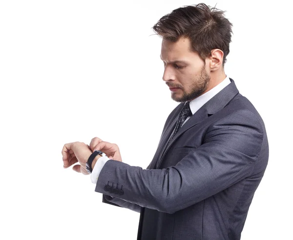 Young business man looking at watch Stock Photo by ©zoomteam 71410875