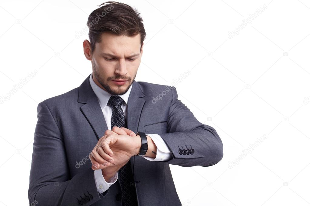 Young business man looking at watch Stock Photo by ©zoomteam 71410837 Young business man looking at watch Stock Photo by ©zoomteam 71410837