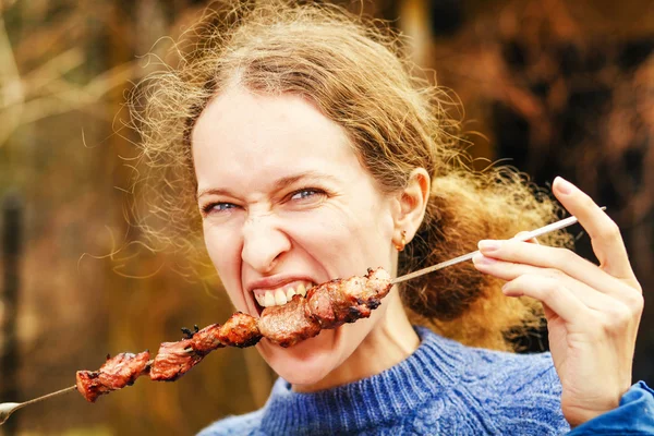 Woman eating kebab - Stock Image - Everypixel
