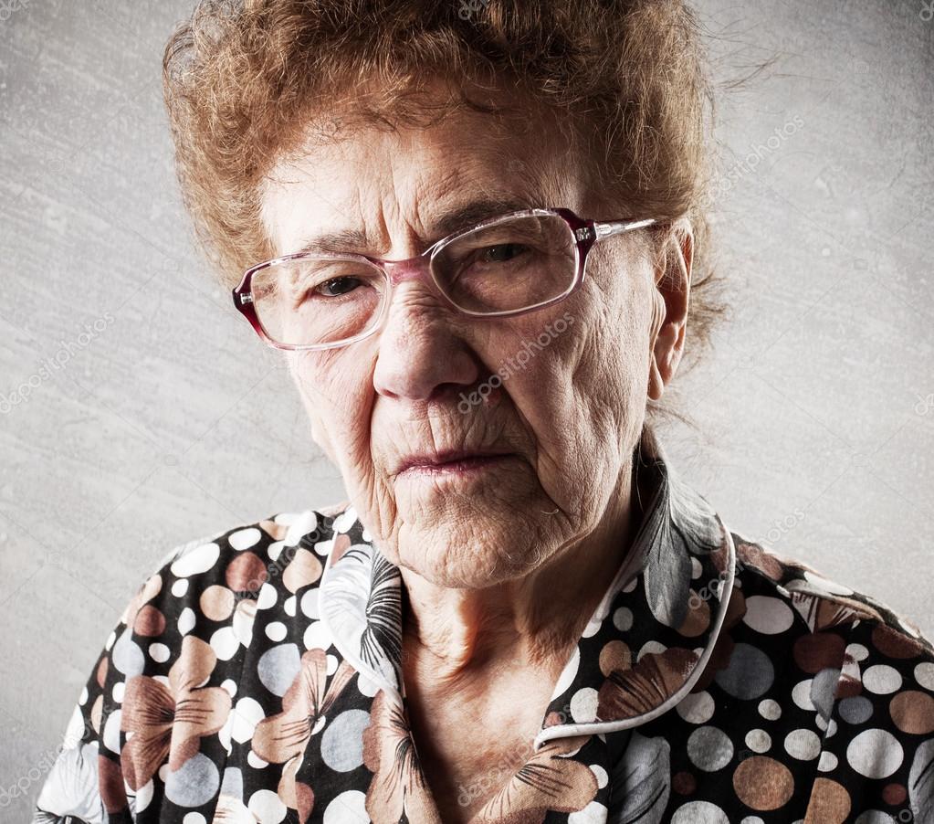 Portrait of an old woman — Stock Photo © TatyanaGl #66936347 Portrait of an old woman — Stock Photo © TatyanaGl #66936347