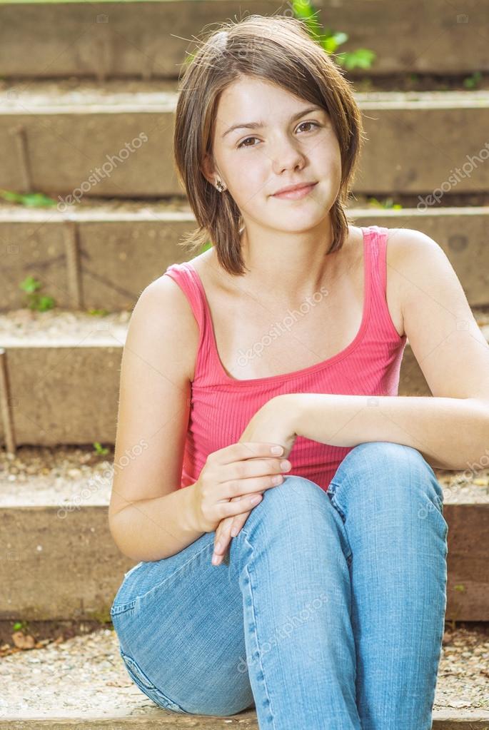Young girl sits on steps — Stock Photo © BestPhotoStudio #59659361