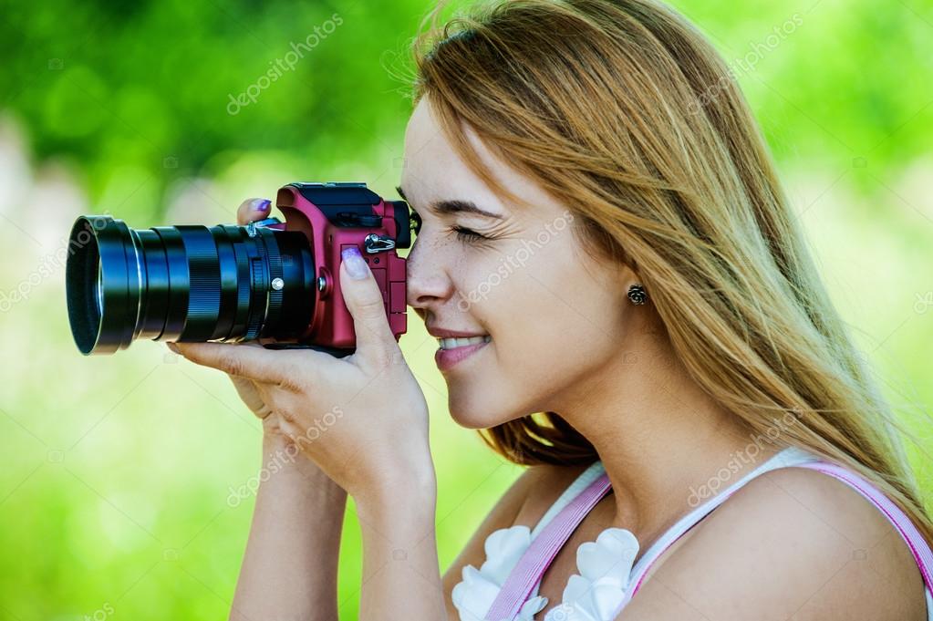 Beautiful girl with camera Stock Photo by ©BestPhotoStudio 68213261