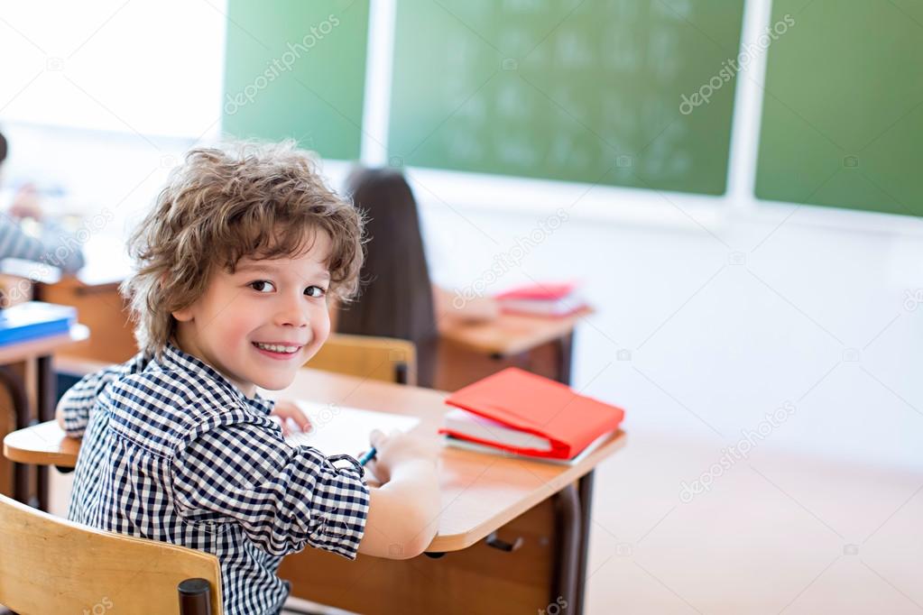 Boy in classroom Stock Photo by ©Deklofenak 115711884