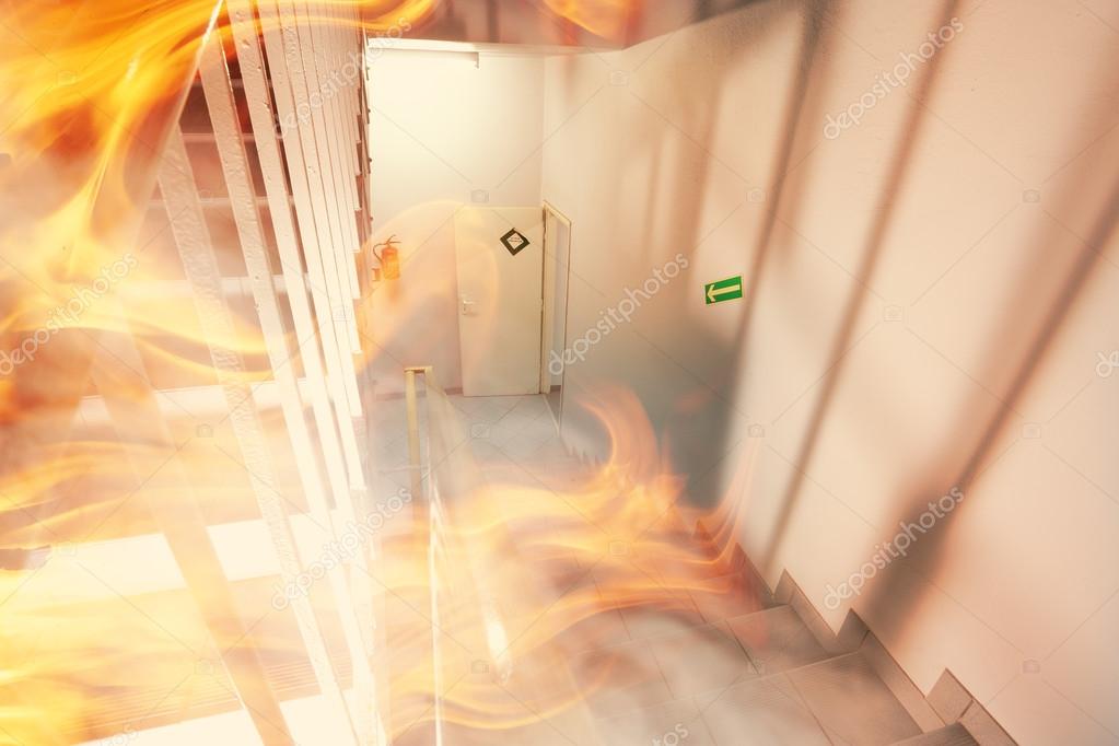 Emergency exit and fire in the building — Stock Photo © ambrozinio ...