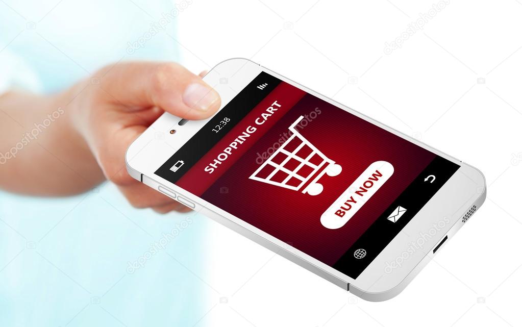 Hand holding mobile phone with shopping cart isolated over whit — Stock ...
