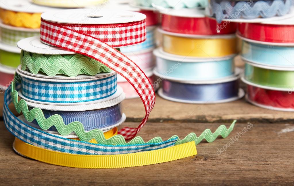 Colorful ribbon rolls on white — Stock Photo © mackowo #56632313