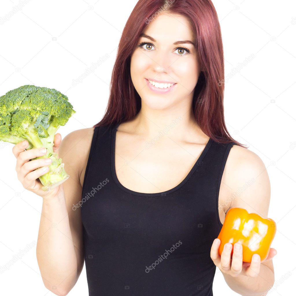 Smiling slim woman holding peppers and broccoli . Diet and proper ...